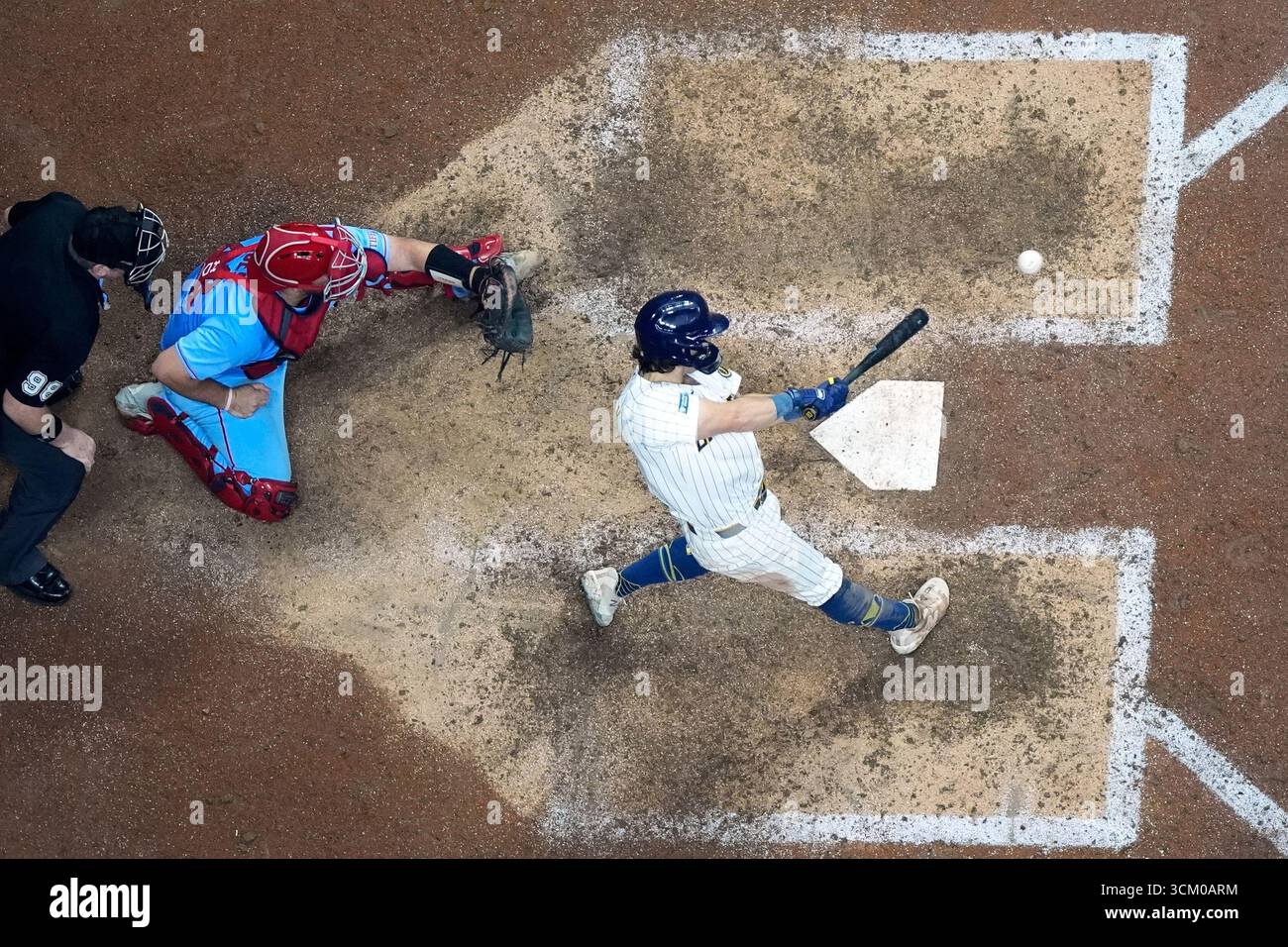 Milwaukee Brewers' Sal Frelick hits an RBI double during the ninth ...