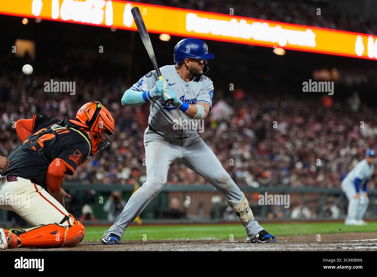 San Francisco Giants catcher Patrick Bailey, left, is unable to corral ...