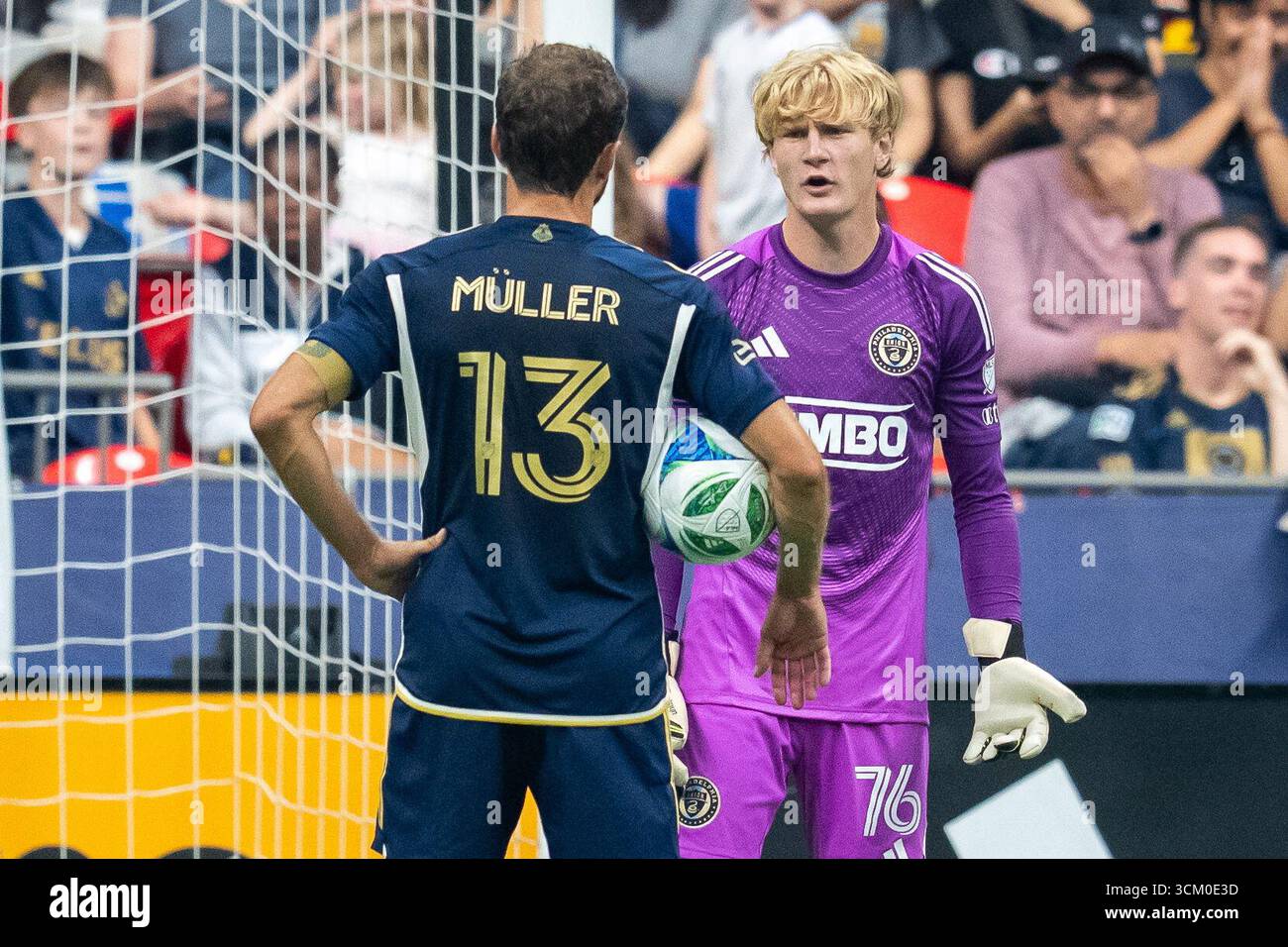 Philadelphia Union goalkeeper Andrew Rick (76) speaks with Vancouver ...