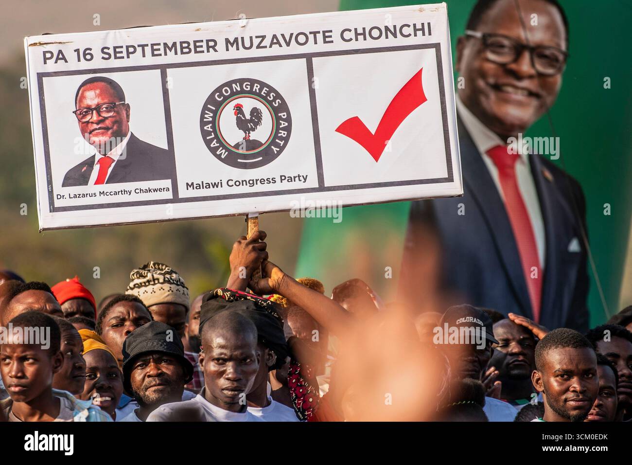 Malawi Congress Party (MCP) supporters hold a poster showing Malawi ...