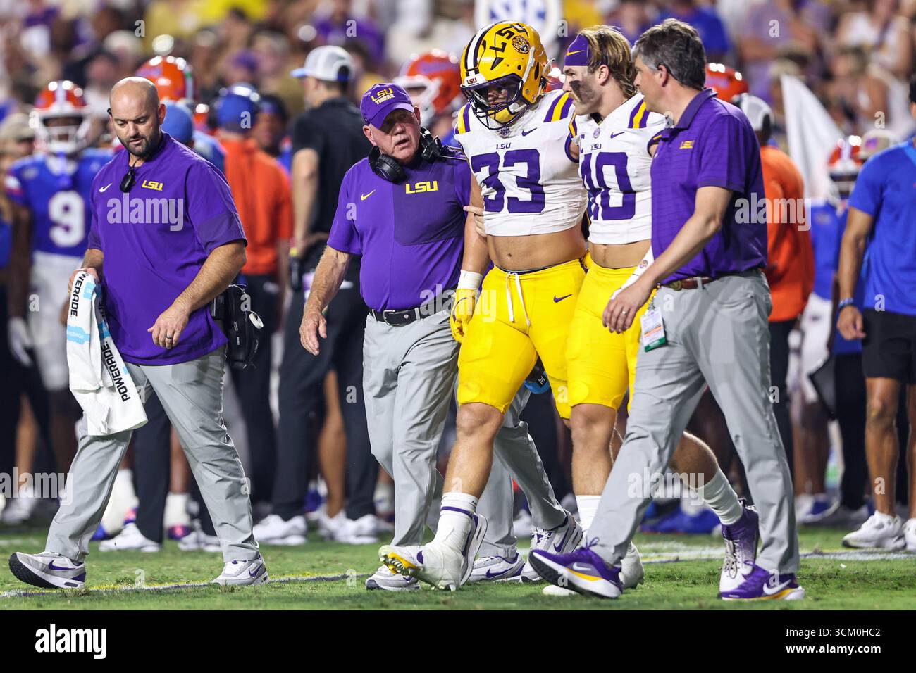 September 13, 2025: LSU linebacker West Weeks (33) is helped off the ...
