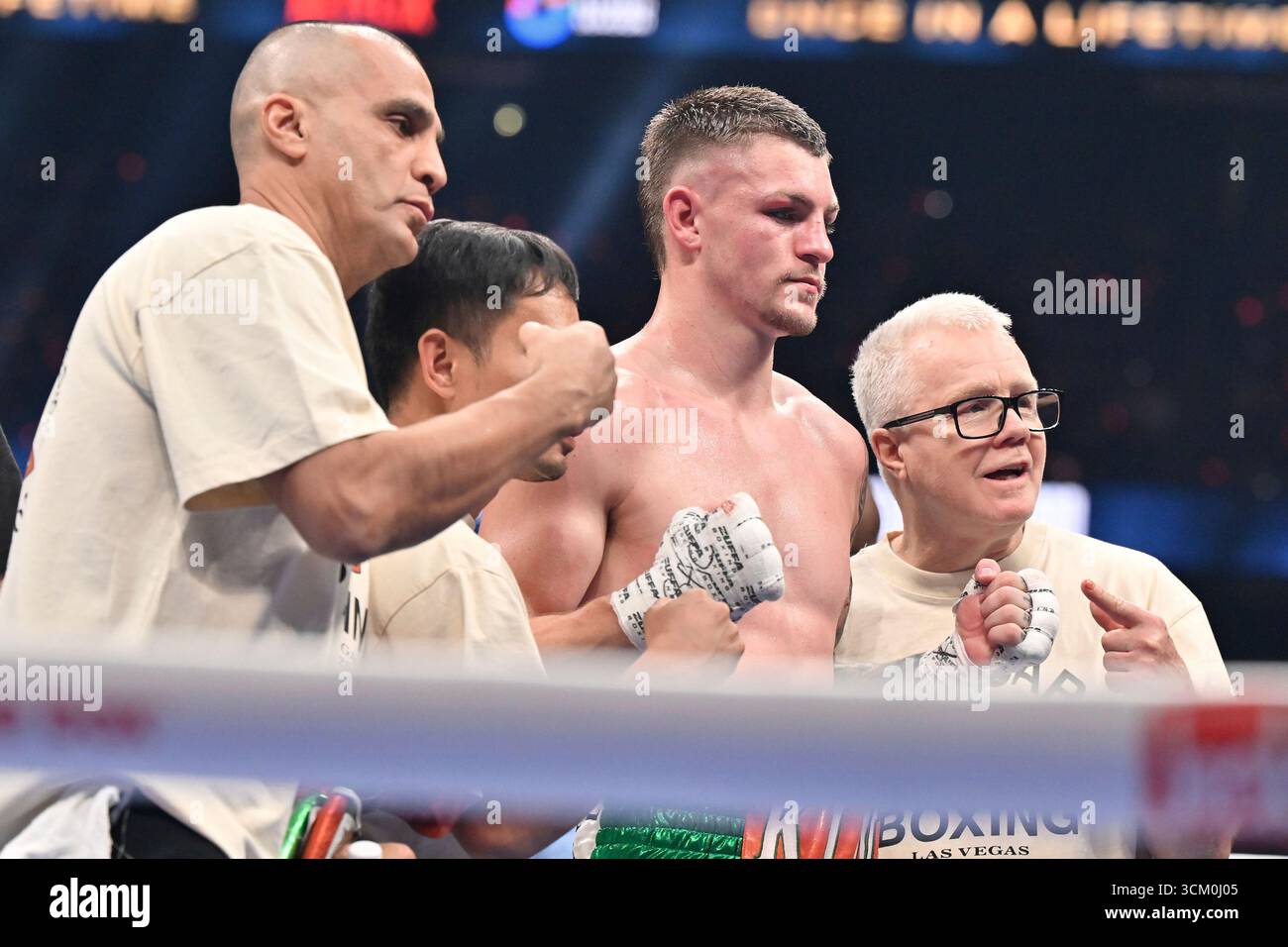 Callum Walsh, second from right, celebrates with trainer Freddie Roach ...