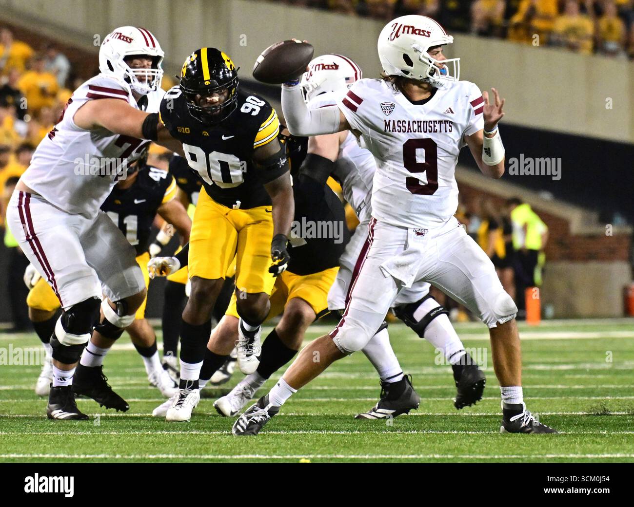 IOWA CITY, IA - SEPTEMBER 13: UMass quarterback Grant Jordan (9) passes ...