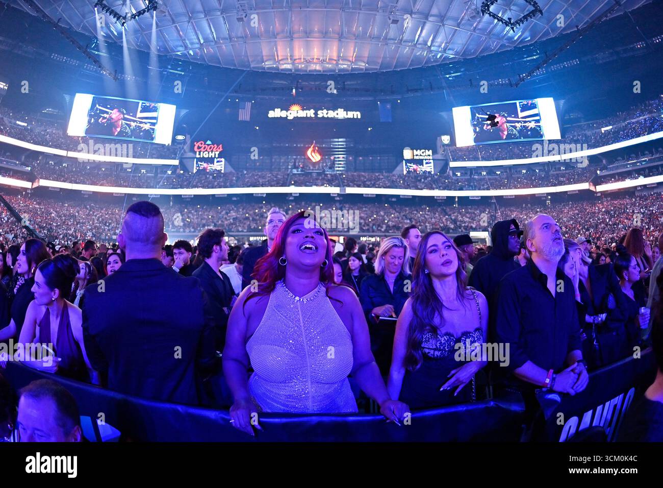 Musician Lizzo, middle, and actress Sofia Vergara, middle right, stand ...