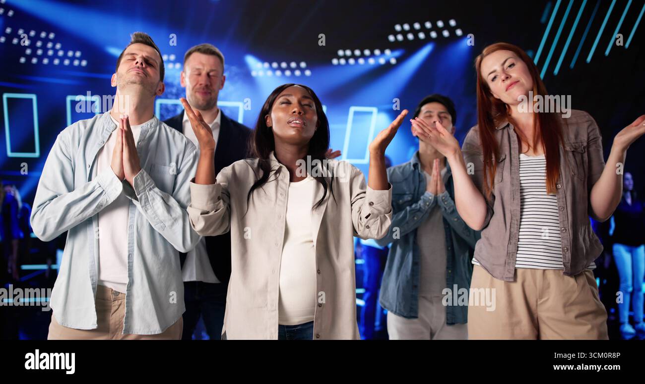 Diverse Group Praying Quietly In Church With Closed Eyes Stock Photo ...