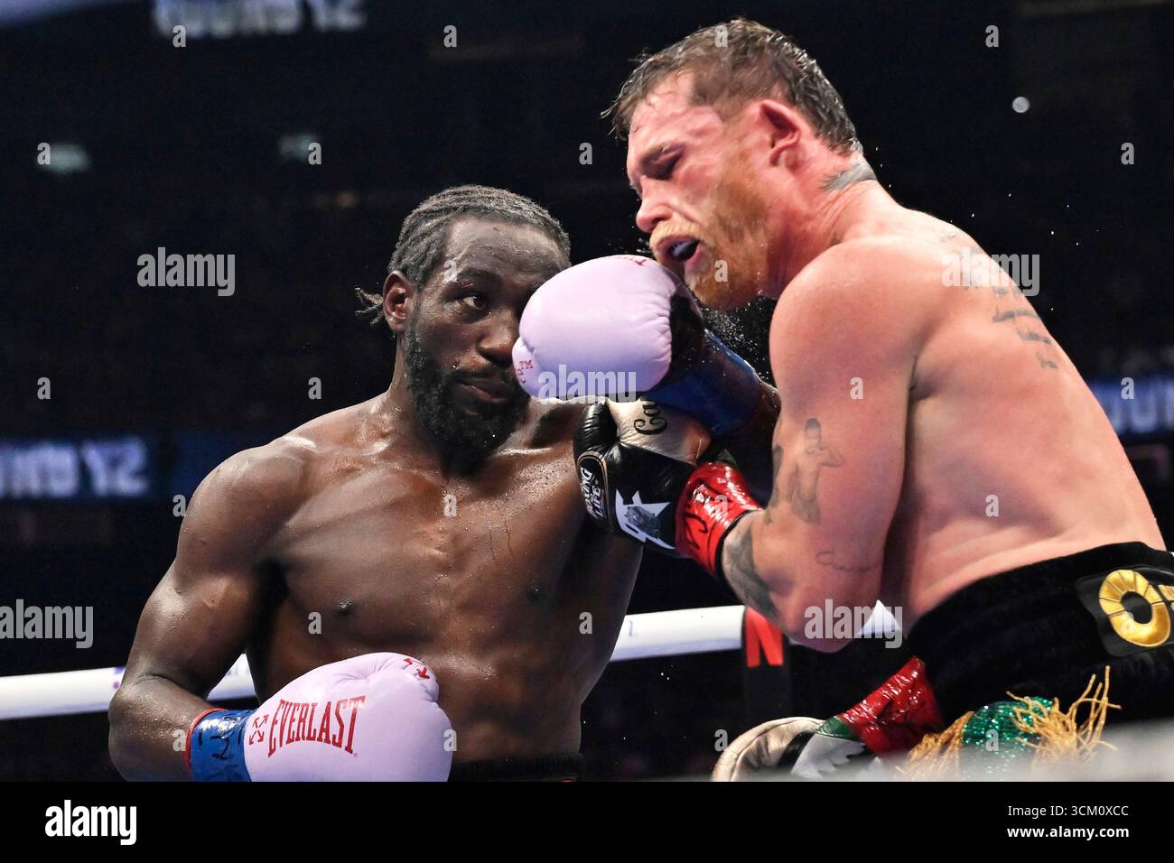 Terence Crawford, left, punches Canelo Alvarez during an undisputed ...