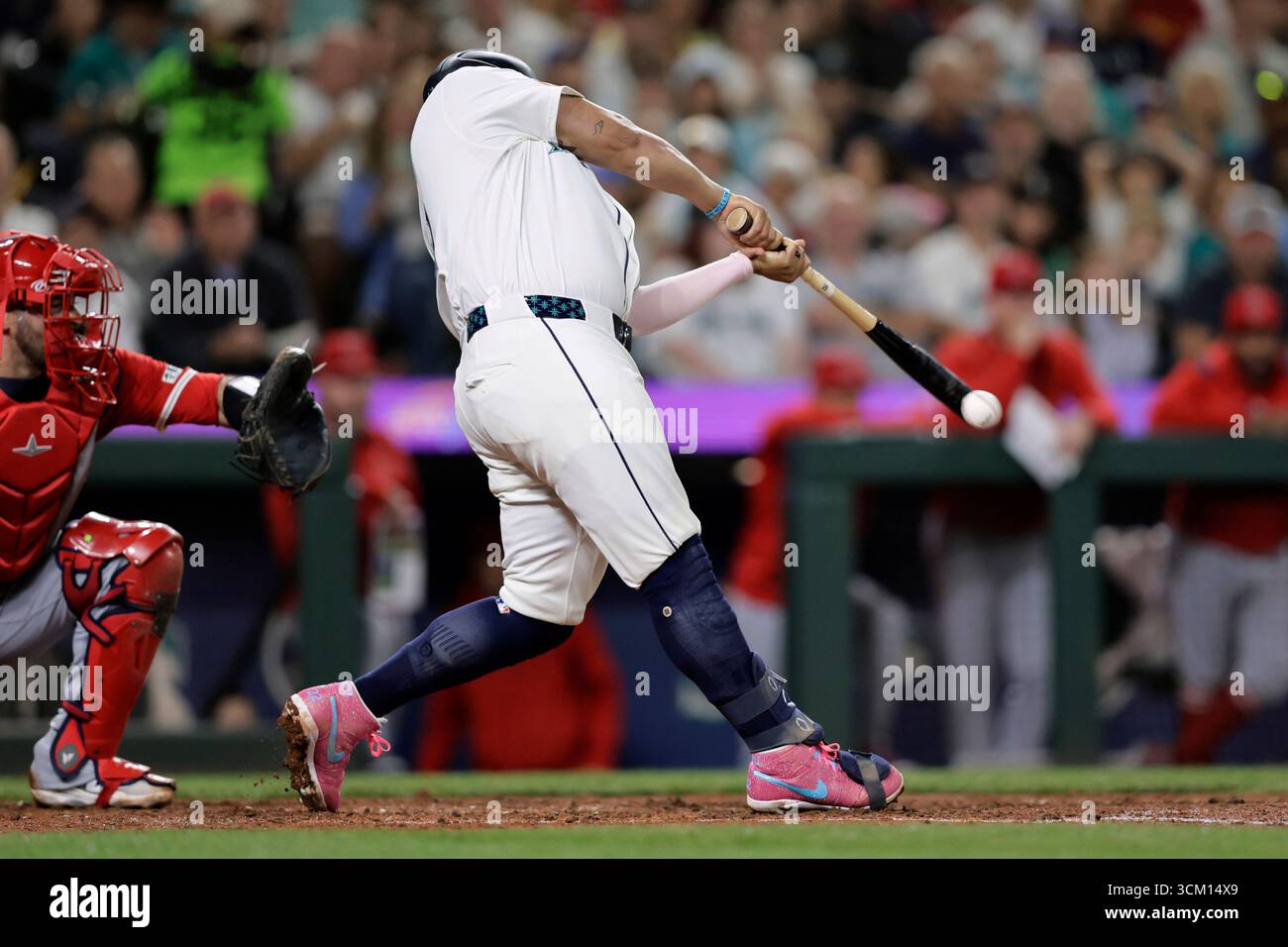 Seattle Mariners' Josh Naylor hits a two-RBI single against the Los ...