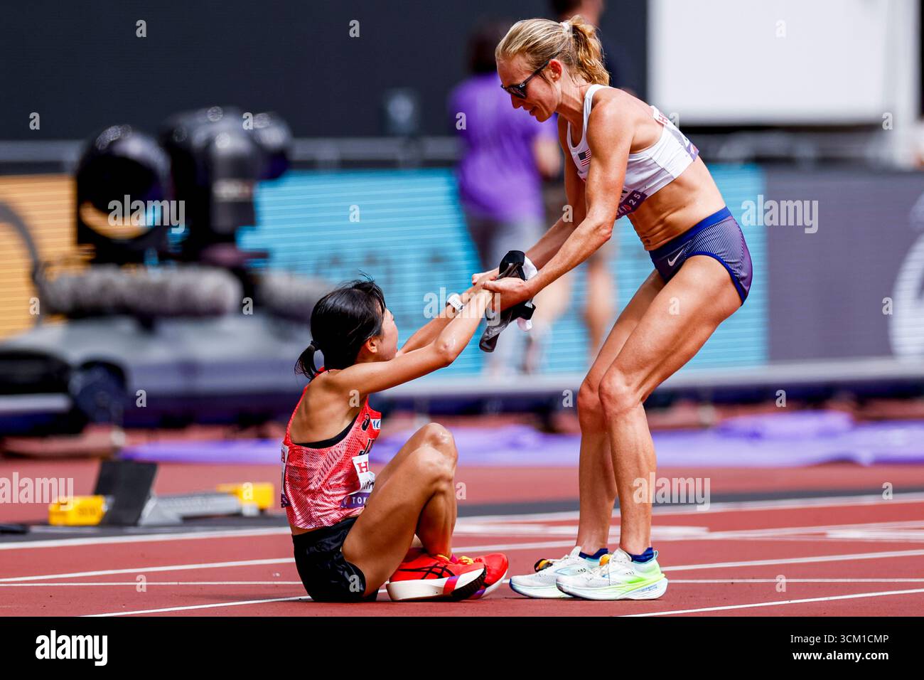 Kana Kobayashi of Japan looks exhausted and Susanna Sullivan of United ...