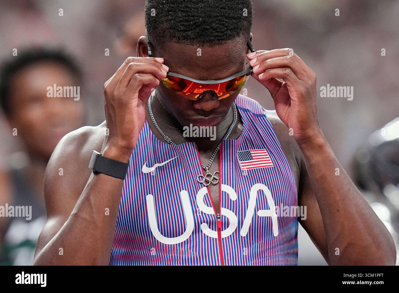 United States' Christopher Bailey adjusts his glasses as he prepares to ...