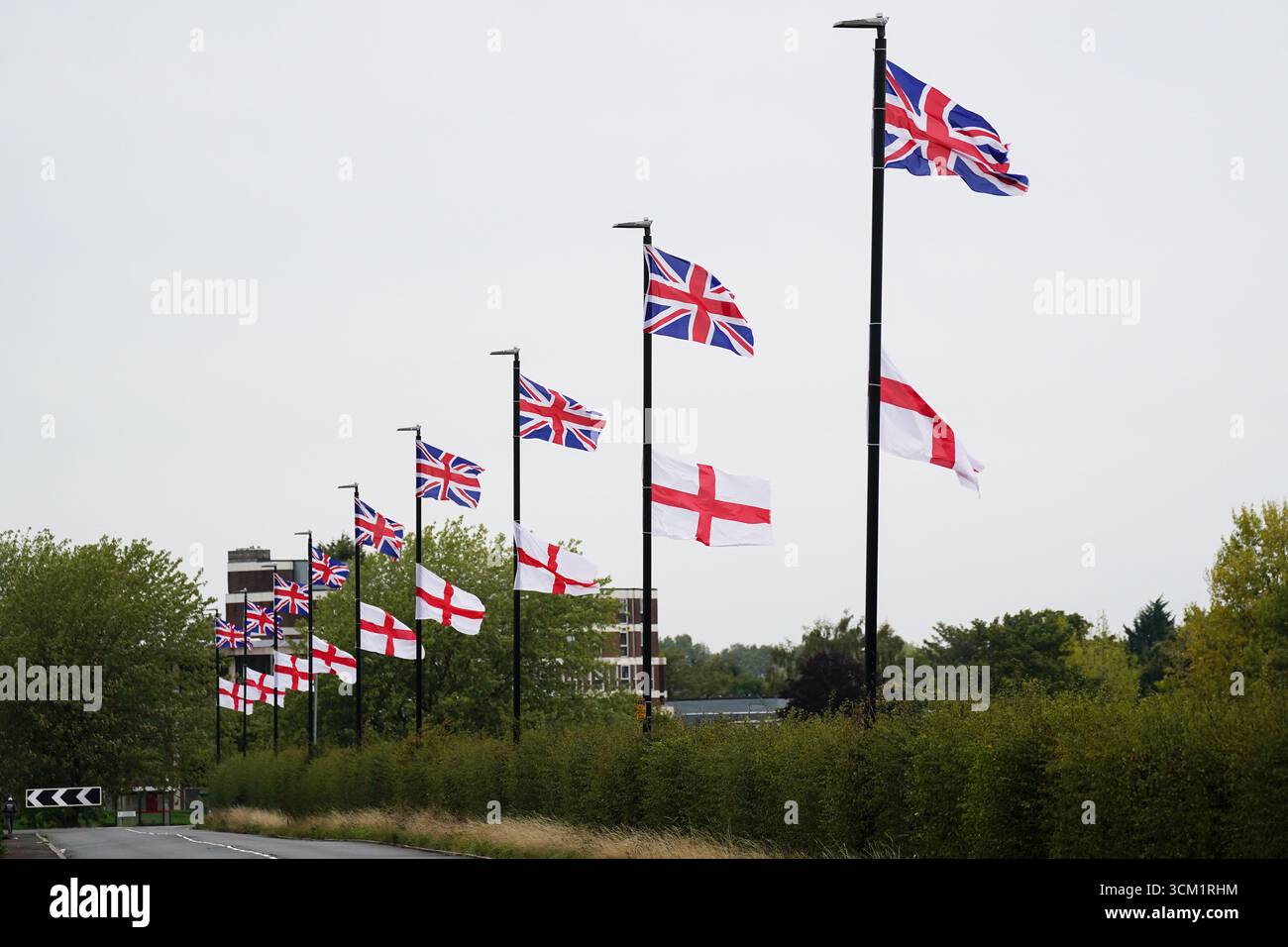 The flag of the United Kingdom and the Flag of St George hang from ...
