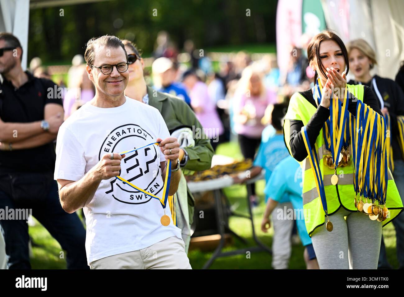Prince Daniel hands out medals to the children running the Prince ...