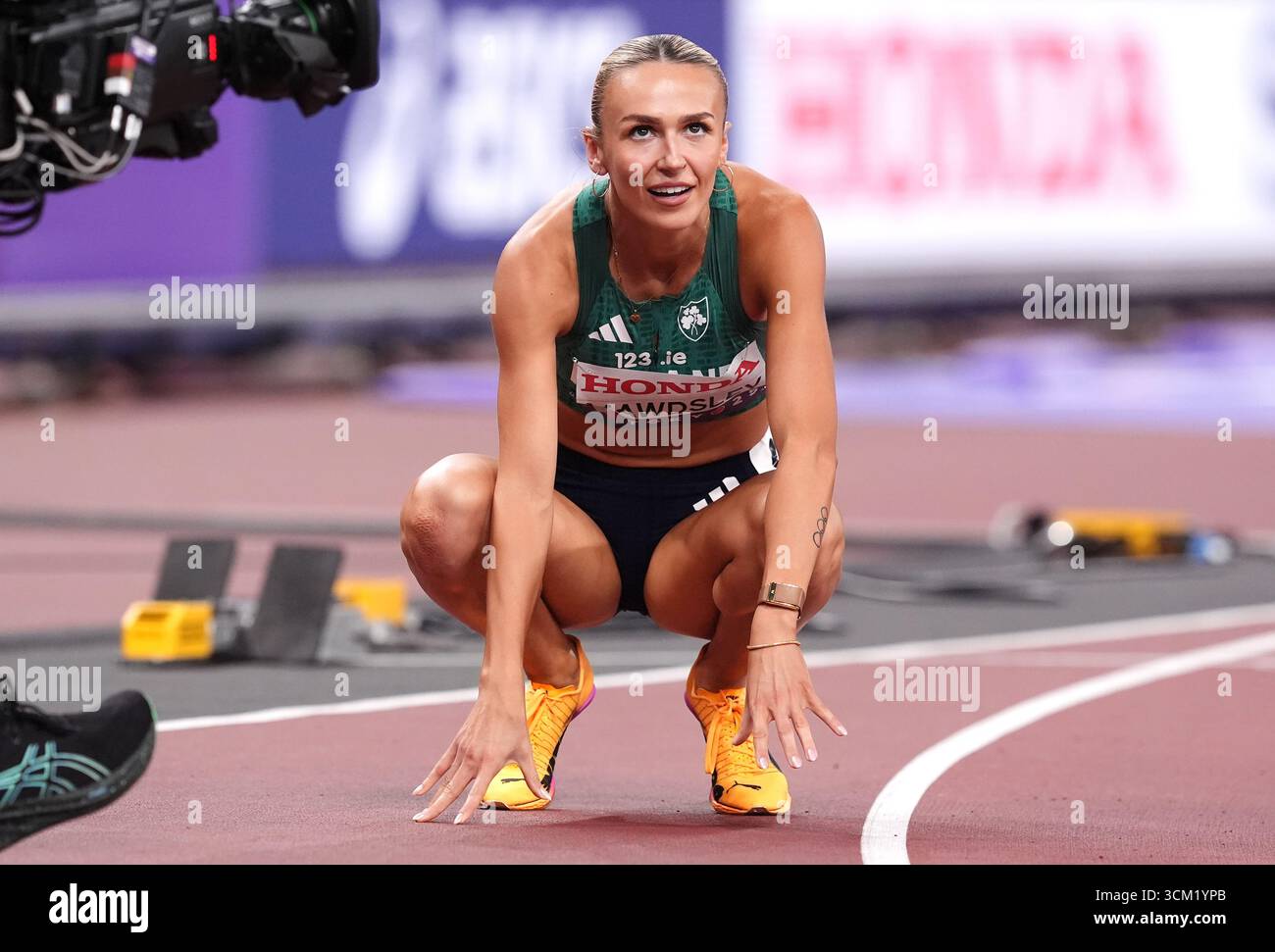 Sharlene Mawdsley of Ireland reacts after competing in heat 3 of the ...
