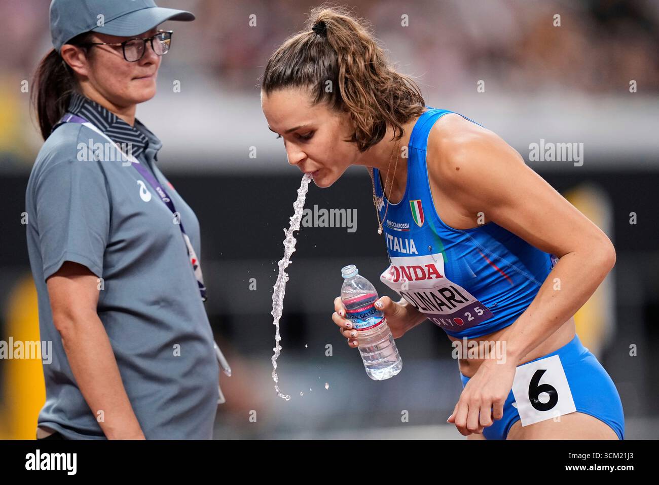 Italy's Anna Polinari spits out water as she prepares to compete in the ...