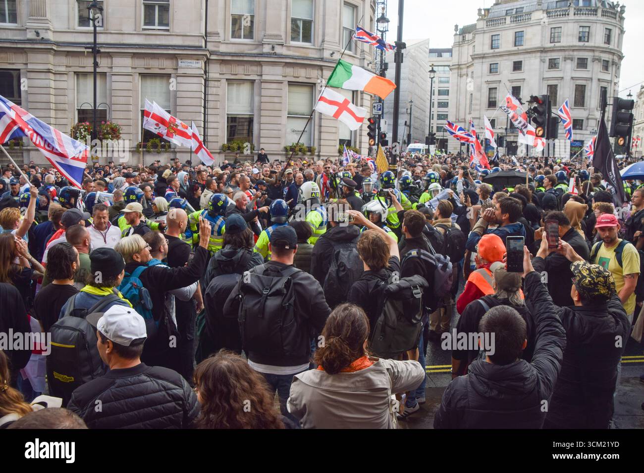 London, UK. 13th September 2025. Riot police keep far-right protesters ...