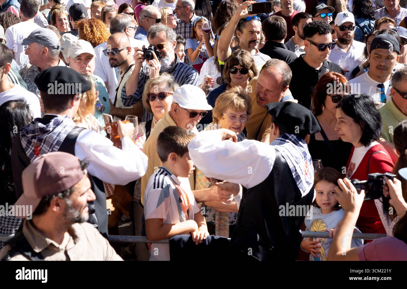Dozens of people during an event to celebrate the grape harvest ...