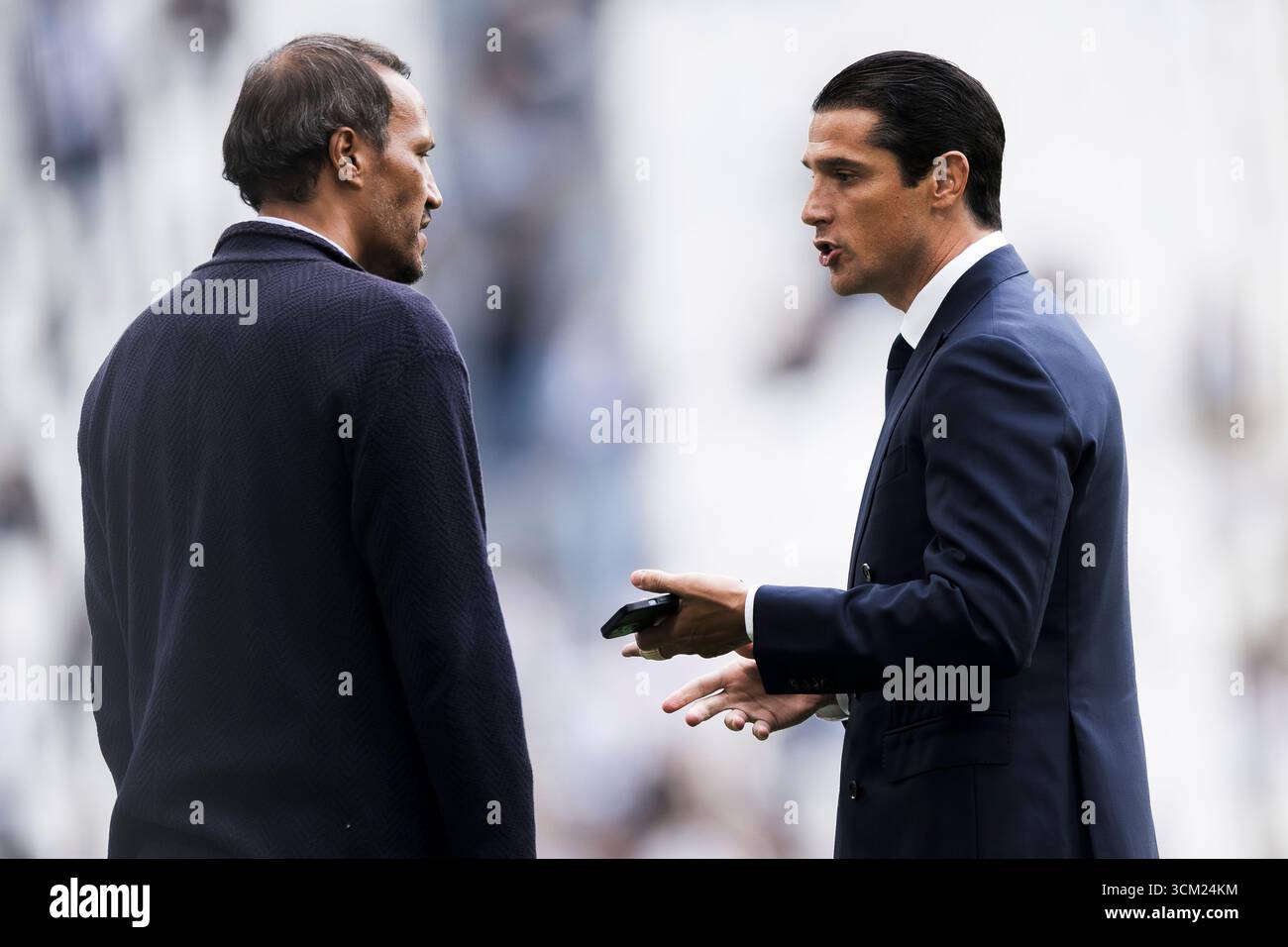 Francois Modesto speaks with Jonathan Zebina prior to the Serie A ...