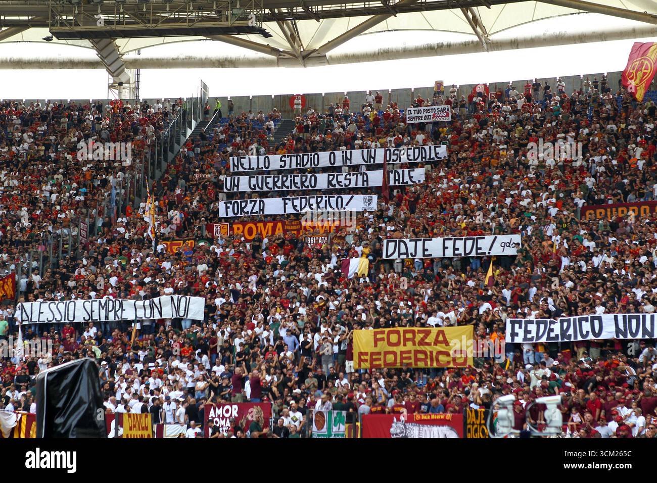 Rome, Italy. 14th Sep, 2025. Supporters of Roma show banners during the ...
