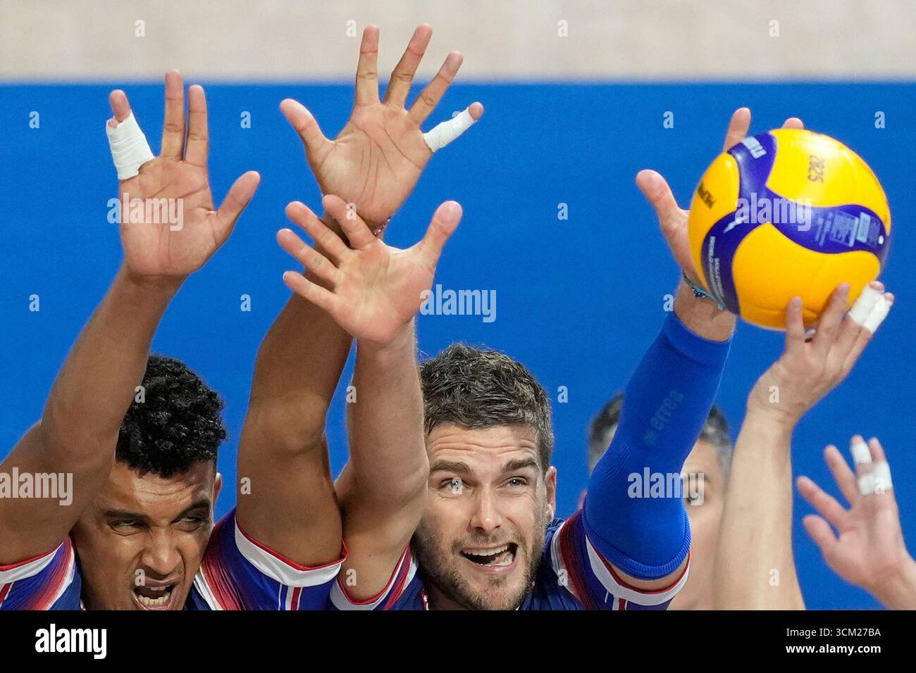 Trevor Clevenot, right, and Barthélémy Chinenyeze of France blocks the ...