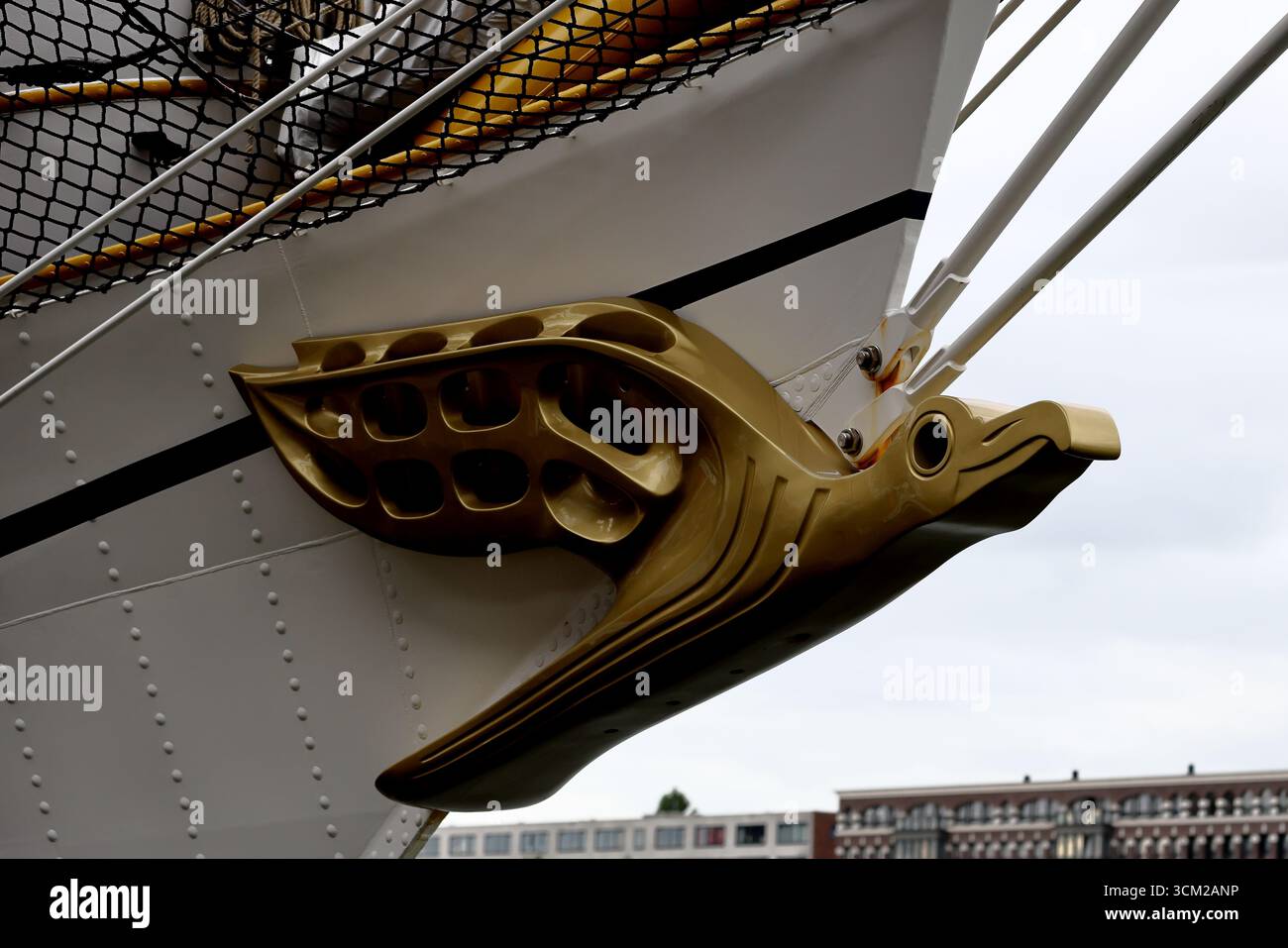 Golden figurehead on the bow of a tall ship at Sail 2025, Amsterdam ...
