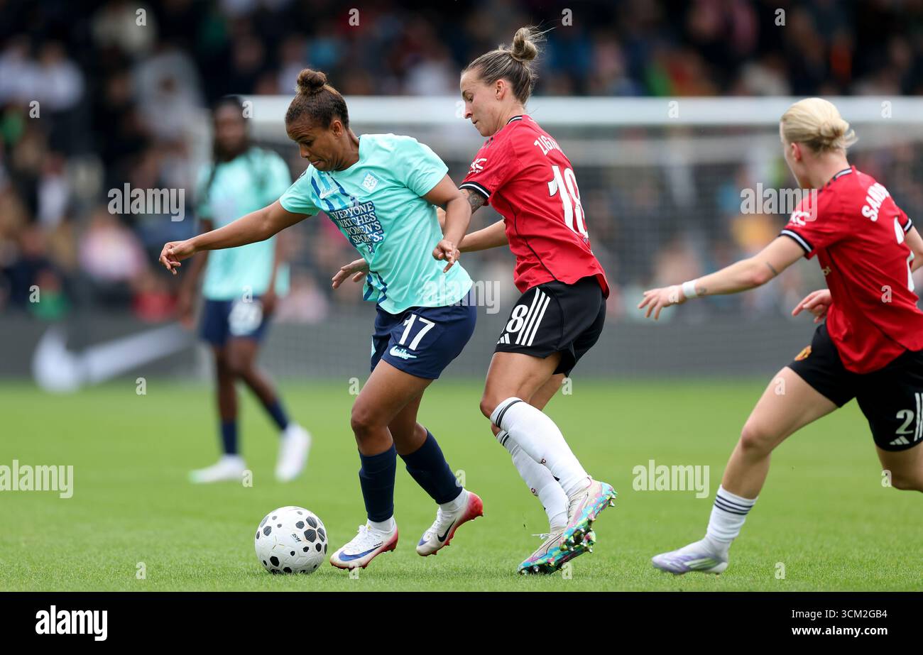 London City Lionesses' Nikita Parris (left) battles for the ball with ...
