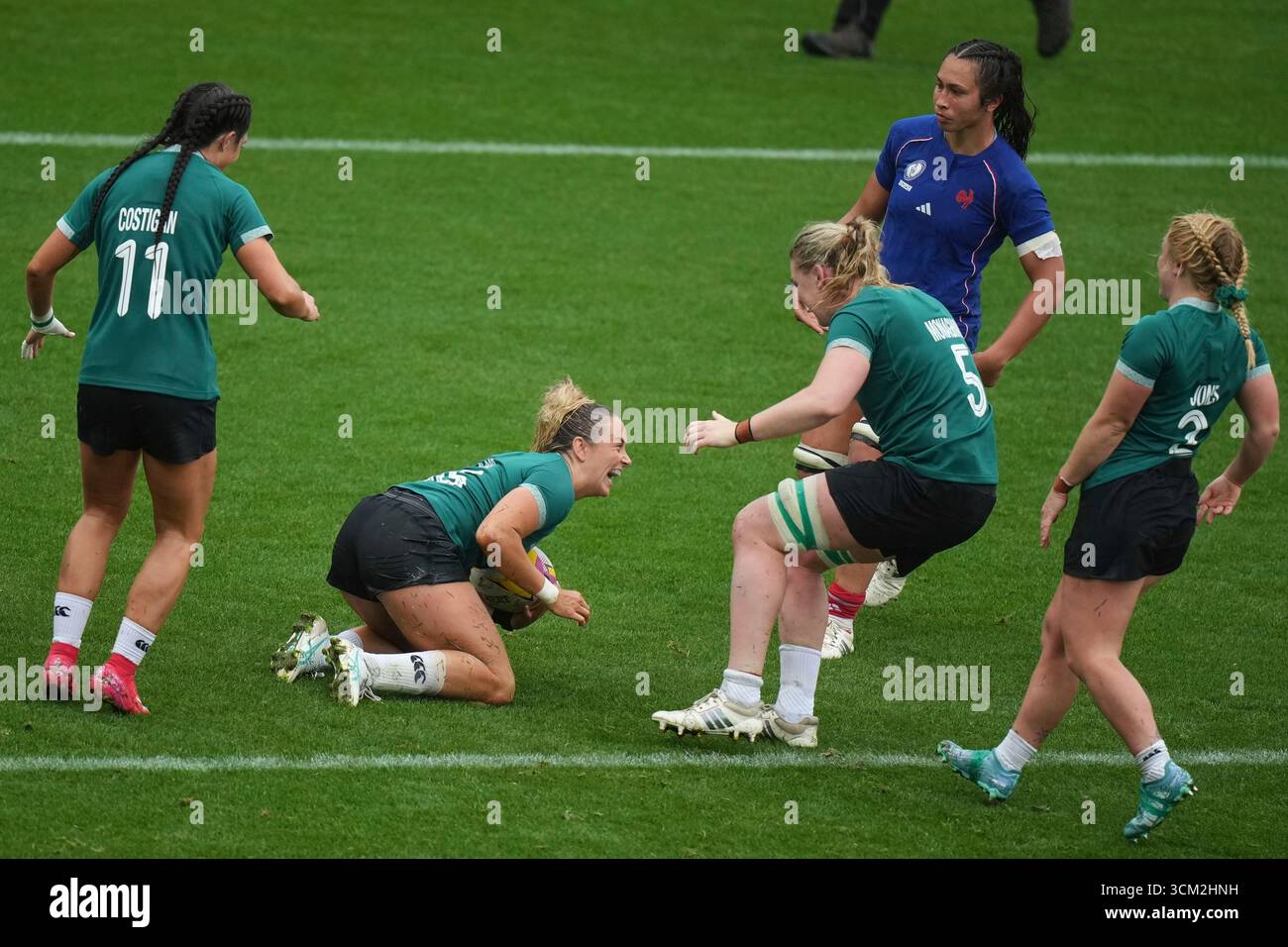Ireland's Stacey Flood, bottom, celebrates with her captain Sam ...