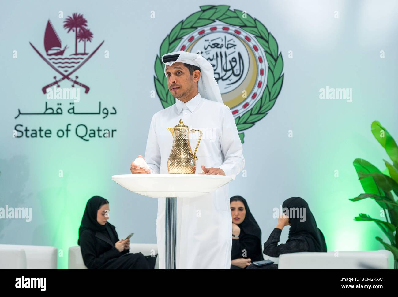 EMERGENCY ARAB-ISLAMIC-SUMMIT IN DOHA A man serves traditional coffee ...