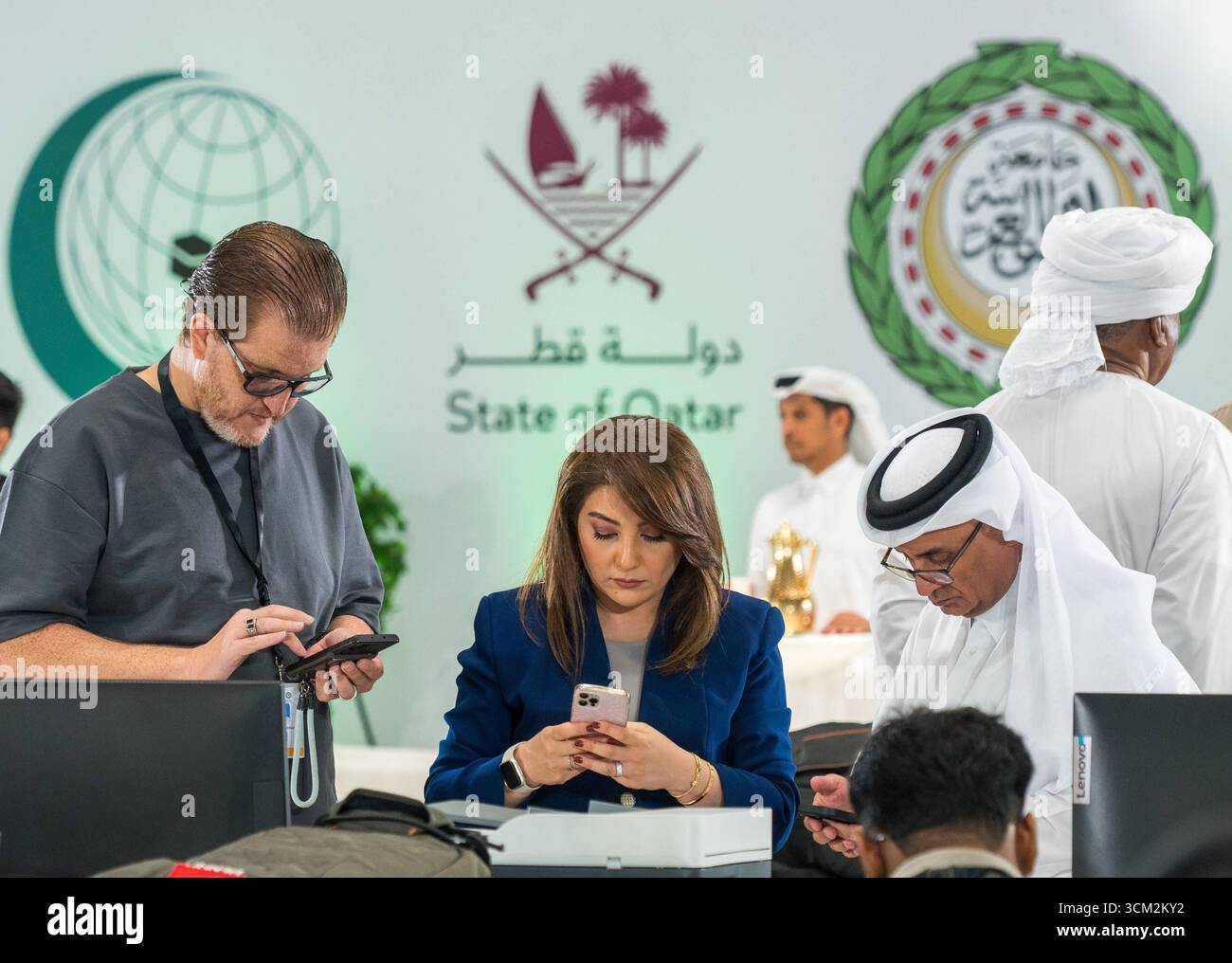 EMERGENCY ARAB-ISLAMIC-SUMMIT IN DOHA Members of the media gather at ...