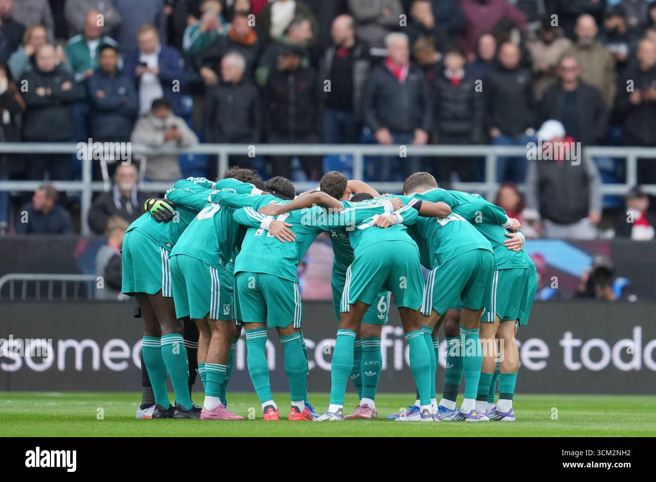 Liverpool players huddles before the Premier League soccer match ...