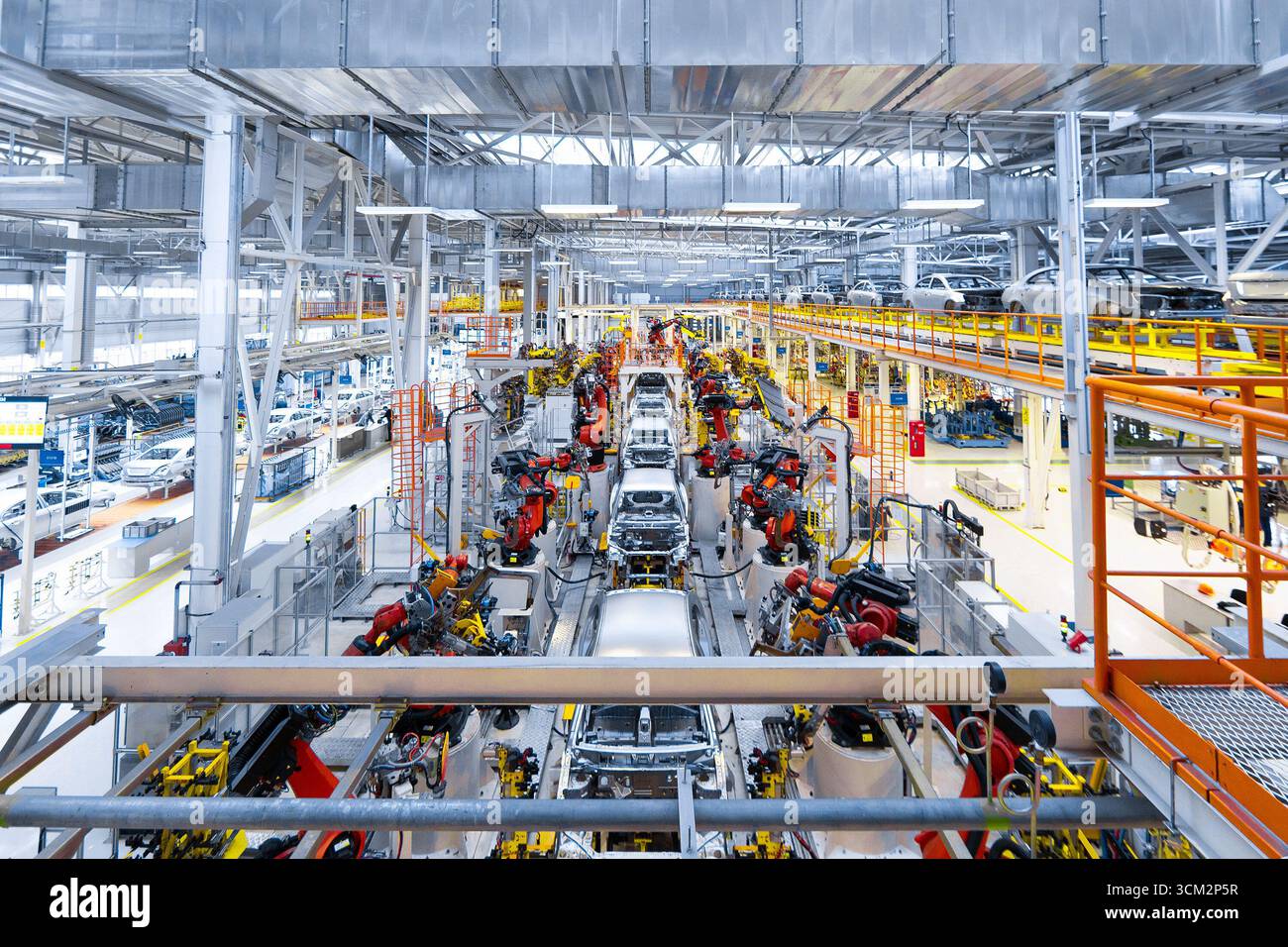 Automotive production line. Welding car body. Modern car Assembly plant ...
