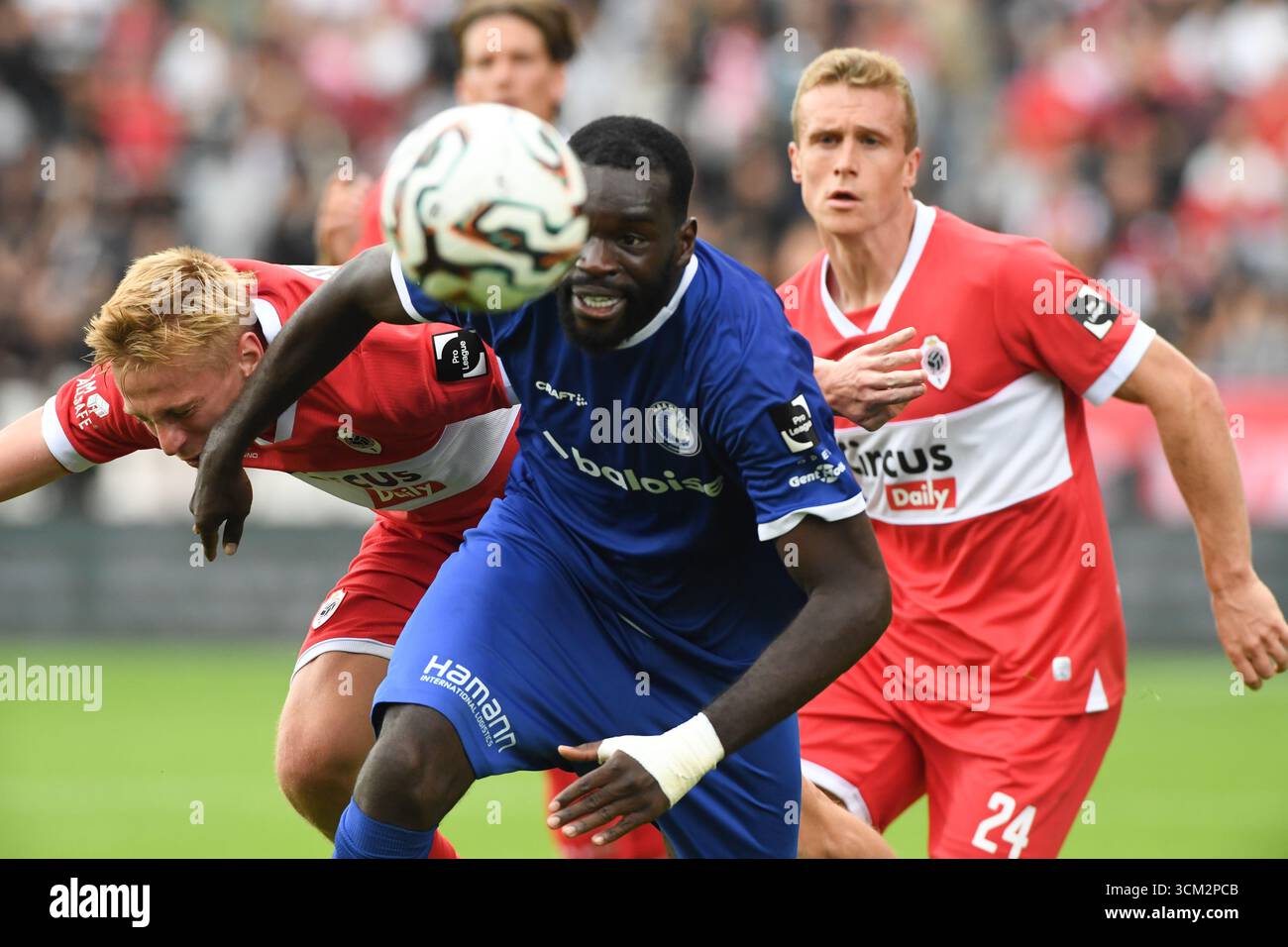 Antwerp's Zeno Van Den Bosch, Gent's Wilfried Kanga and Antwerp's Thibo ...