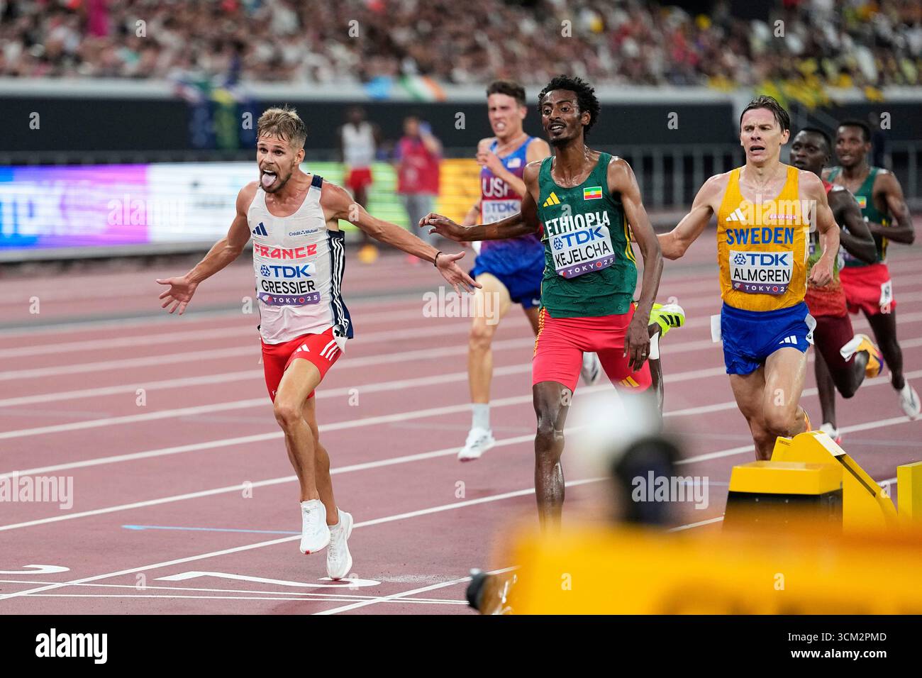 France's Jimmy Gressier crosses the finish line to win the men's 10,000 ...
