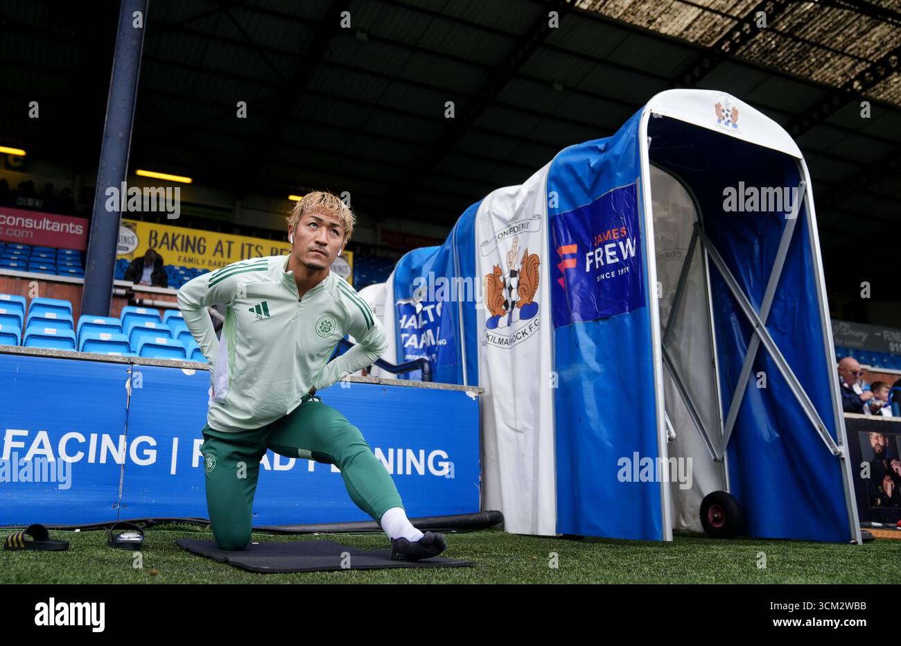 Celtic's Daizen Maeda warms up ahead of the William Hill Premiership ...