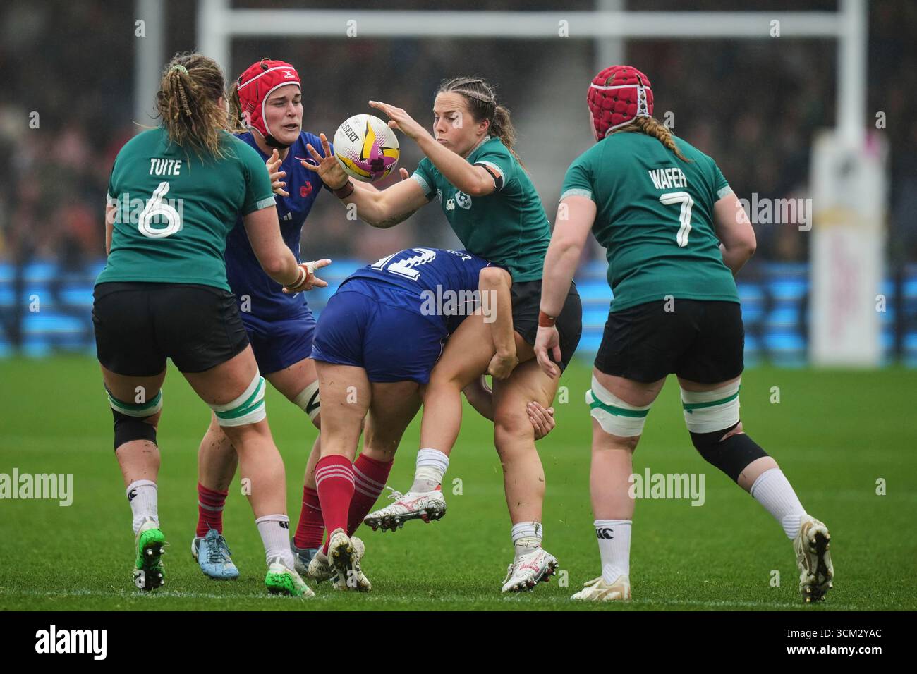 Ireland's Aoibheann Reilly, center, is tackled by France's Gabrielle ...