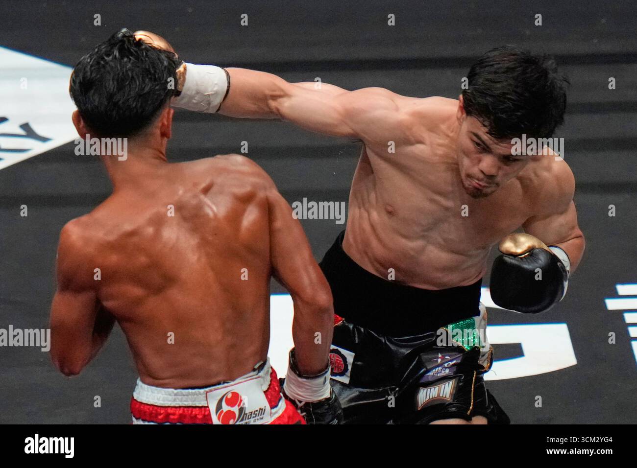 Christian Medina, right, of Mexico hits Yoshiki Takei of Japan during a ...