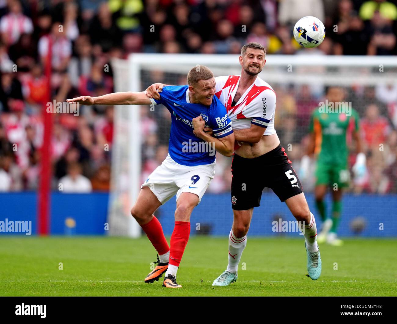 Portsmouth's Colby Bishop (left) battle for possession of the ball with ...
