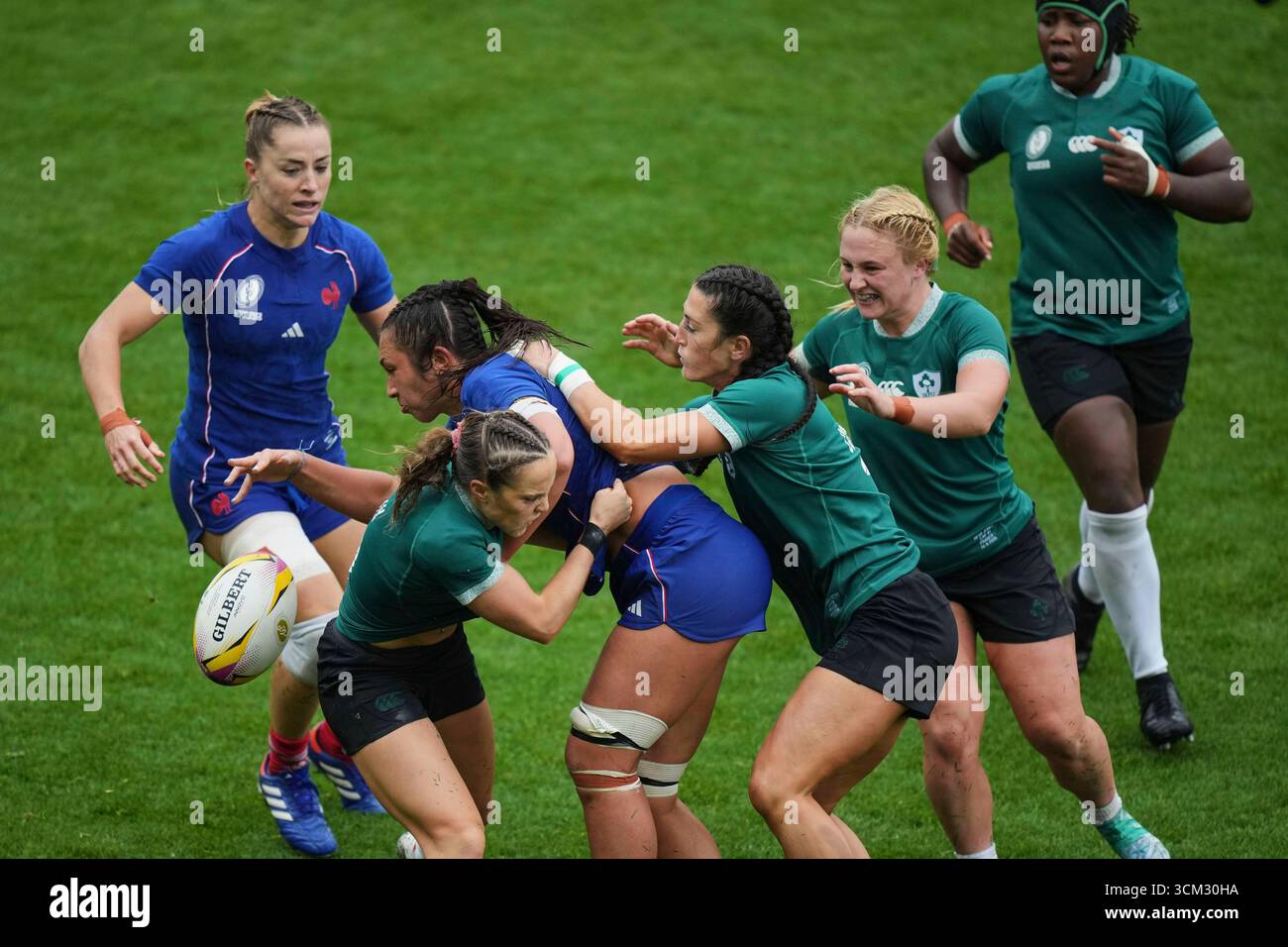 France's captain Mane Feleu, center, looses the ball as Ireland's ...