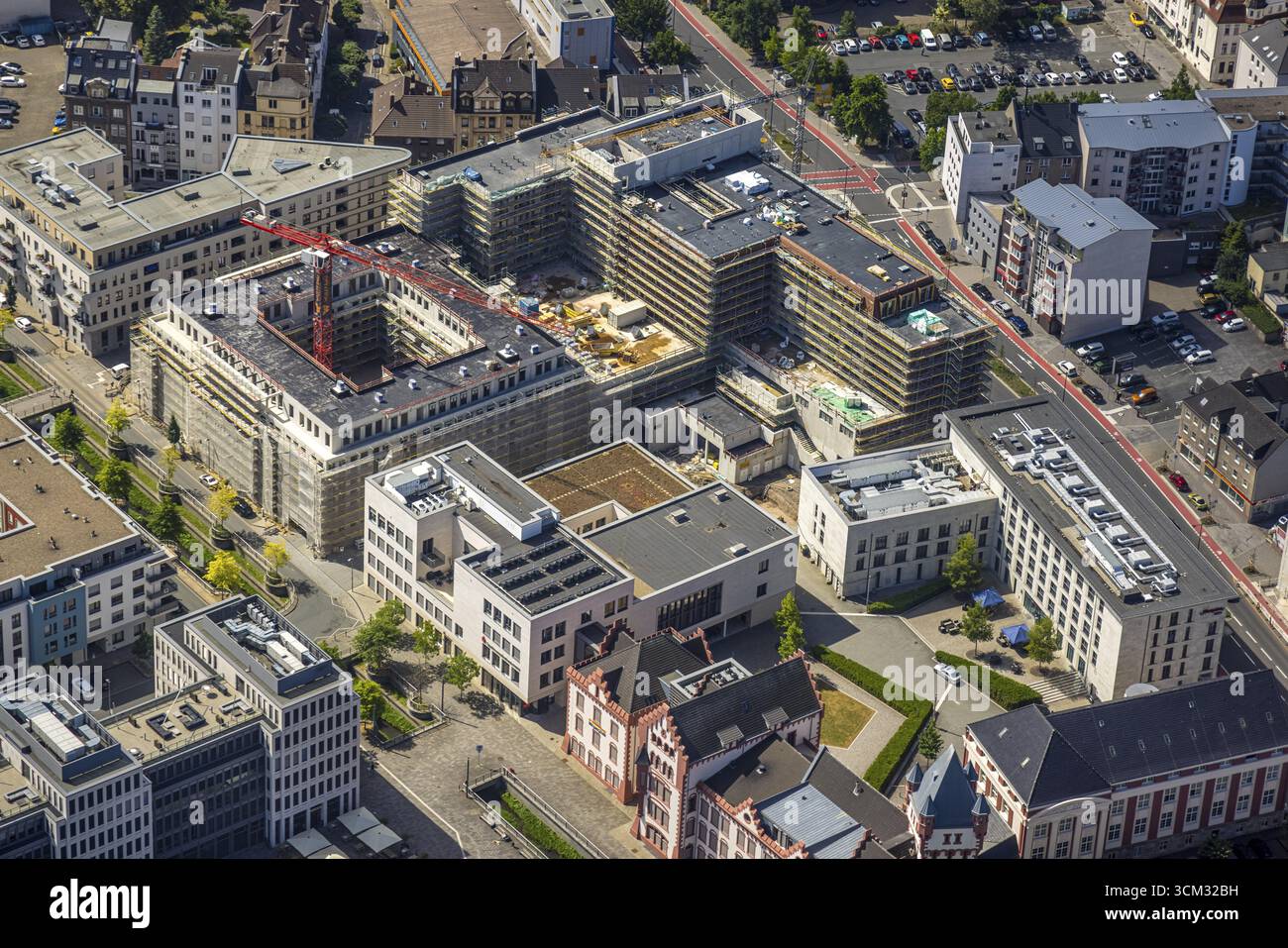 Commercial buildings with construction site rudolf platte weg corner ...