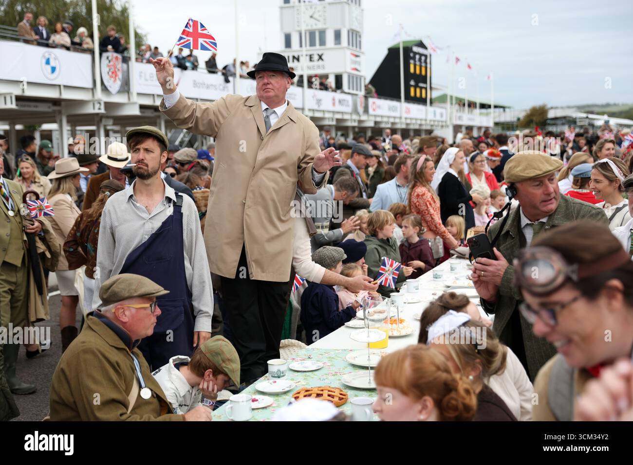 Racemeet goers take part in a VE Day 80th-anniversary street party on ...