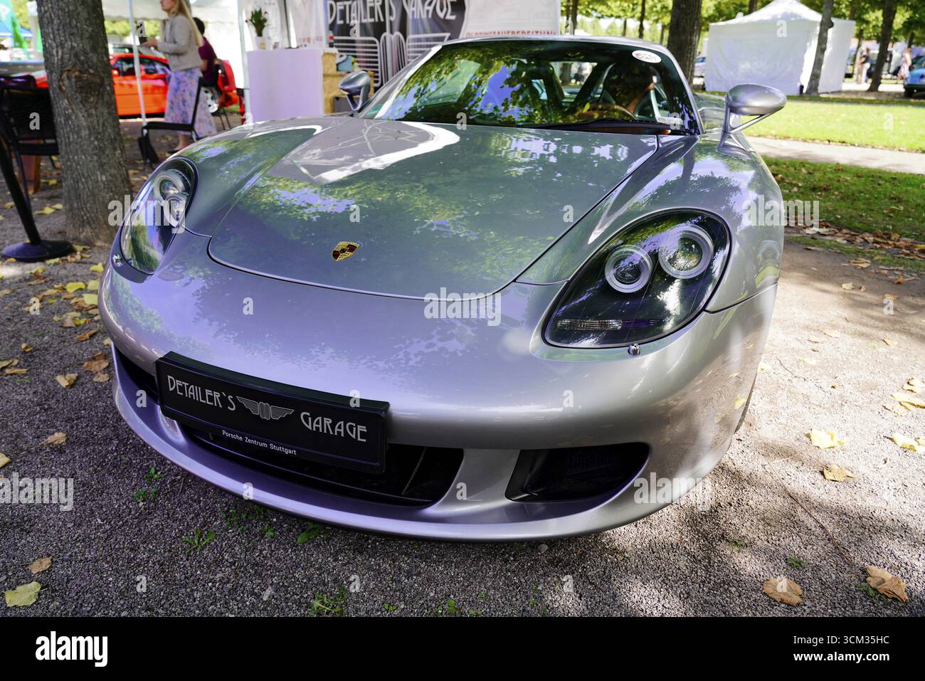 Porsche Carerra GT, Silver Porsche with modern lines on display in the ...