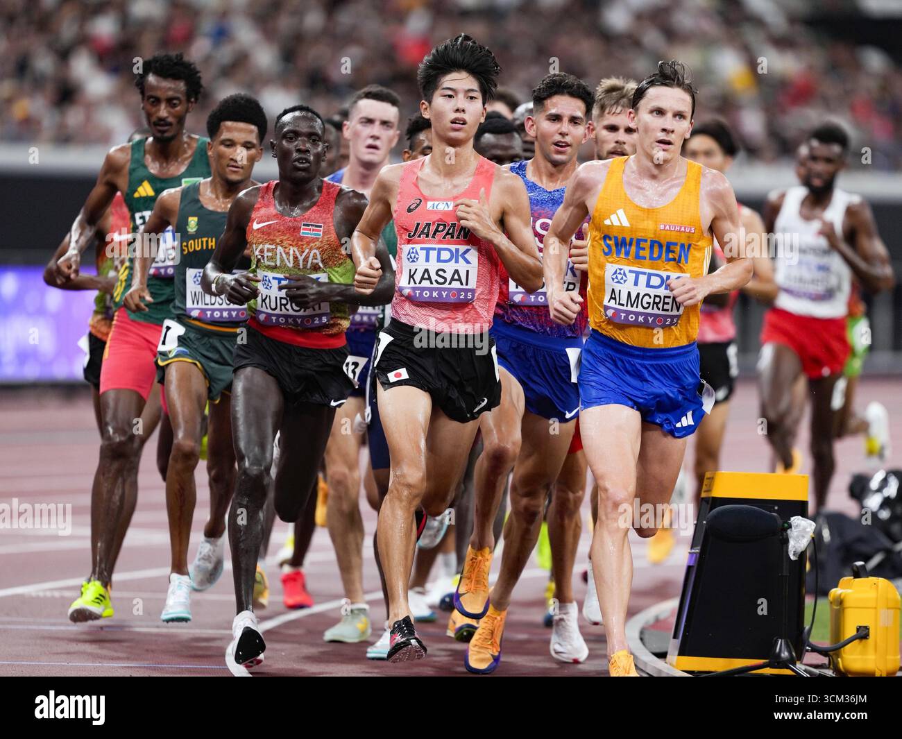 Athletes compete in the men's 10,000-meter event at the World Athletics ...