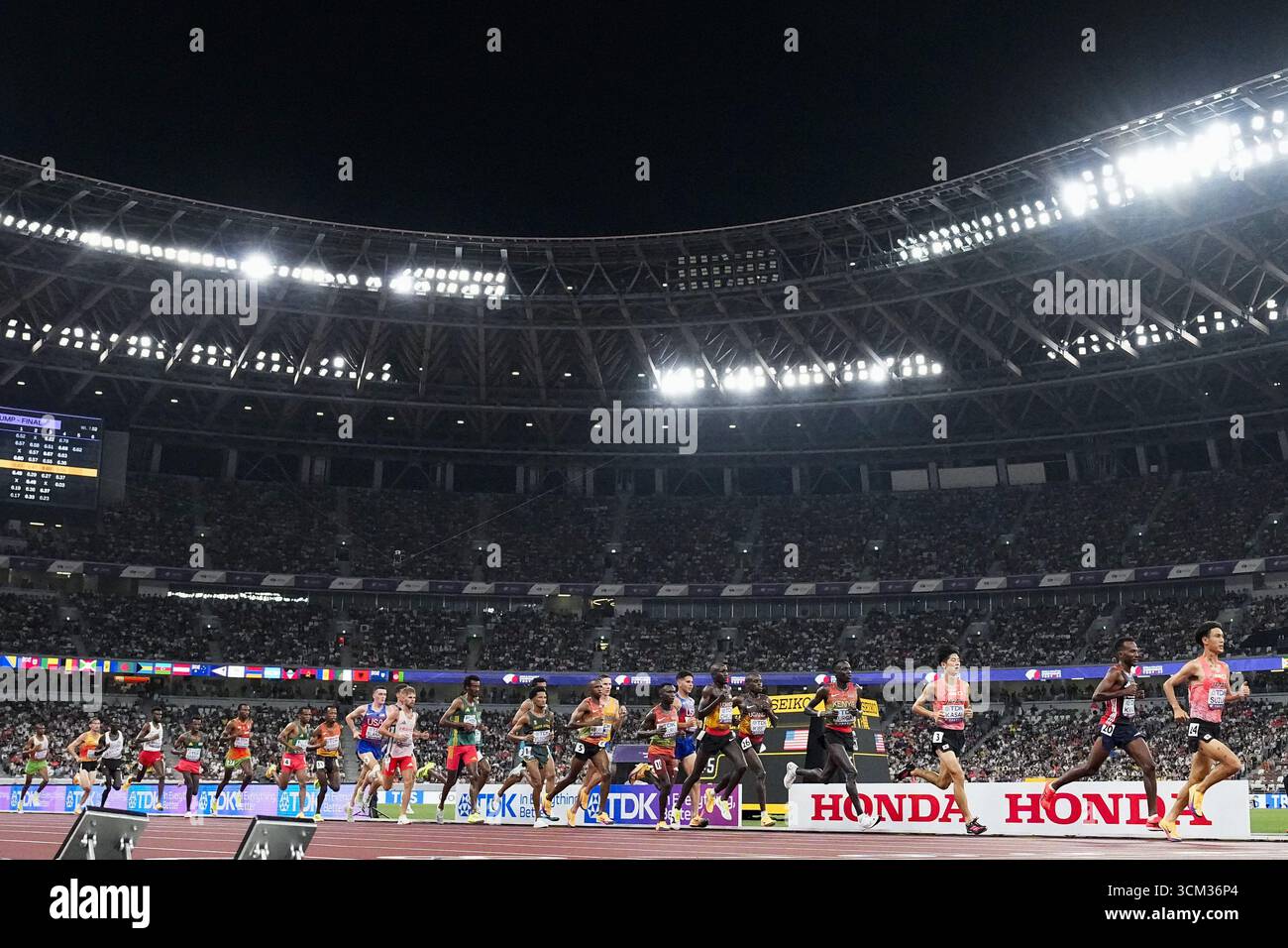 Athletes compete in the men's 10,000-meter event at the World Athletics ...