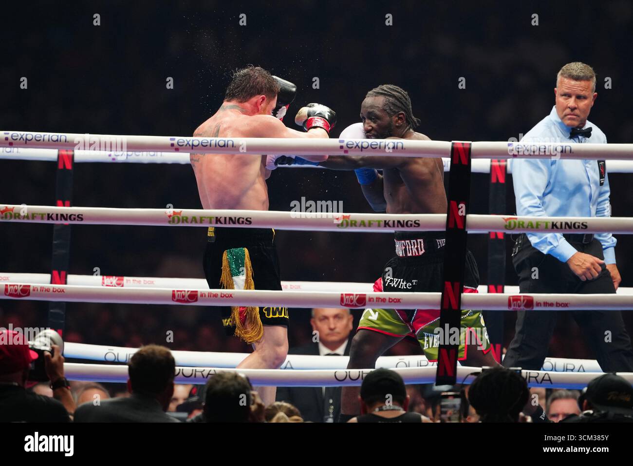 LAS VEGAS, NV - SEPT 13: (R-L) Terence Crawford punches Canelo Alvarez ...