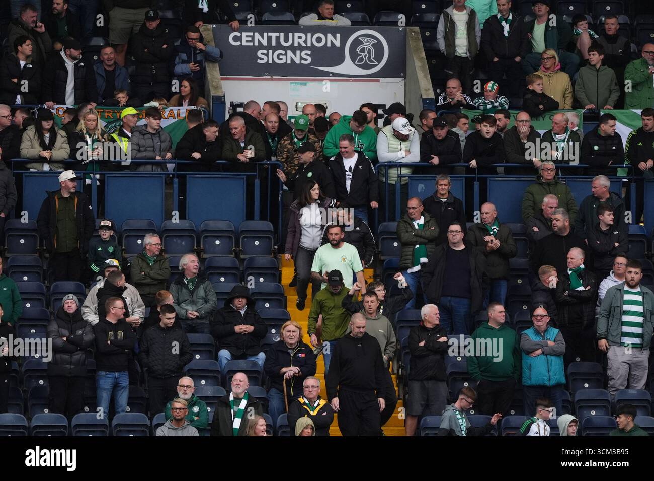 Celtic fans arrive in the away stands ten minutes after kick off as a ...
