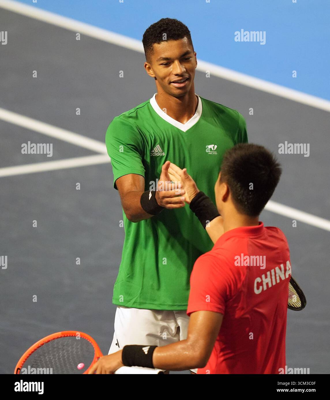 Michael Agwi of Ireland celebrates his win over Sun Fajing of China ...