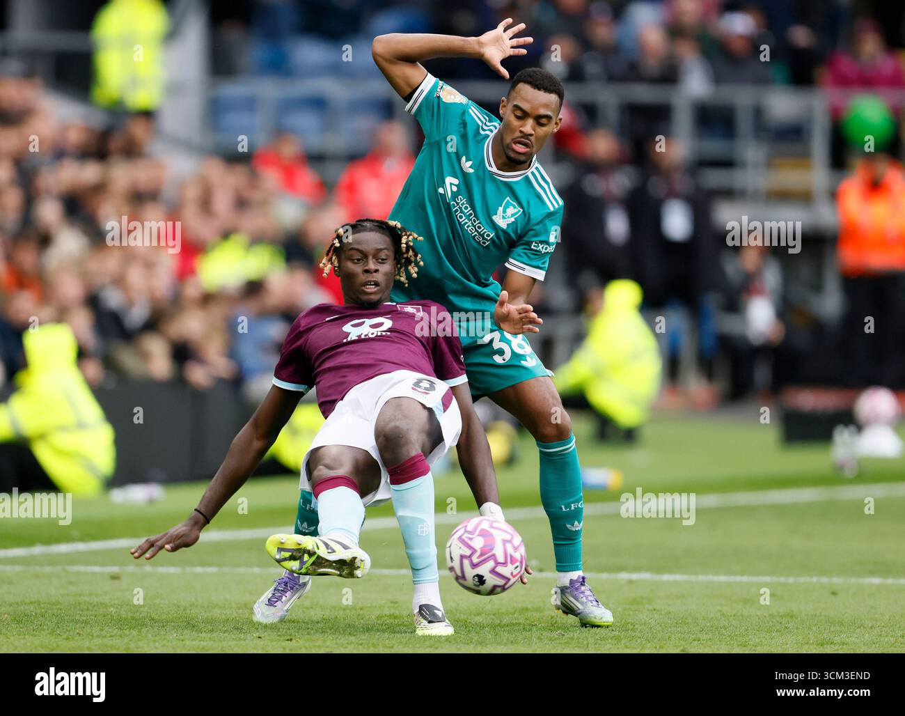 Burnley's Lesley Ugochukwu and Liverpool's Ryan Gravenberch battle for ...
