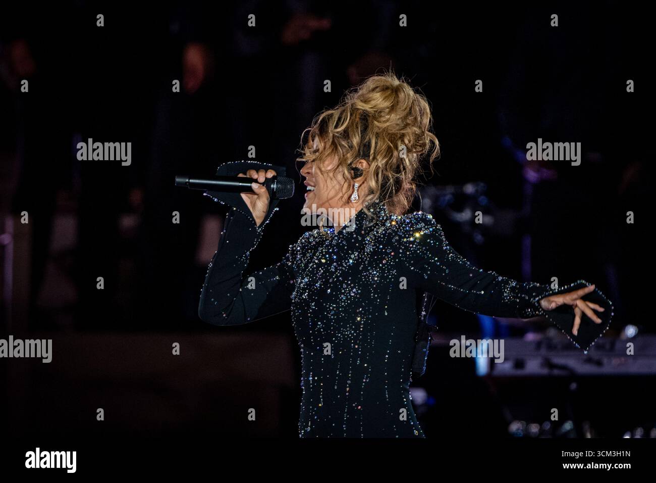 Karol G performs on the stage during the “Grace For The World” event at ...