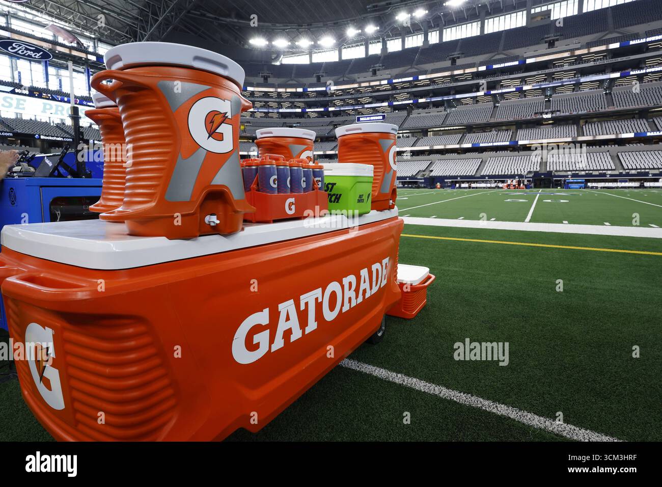 Gatorade cooler and water bottles are shown on the sideline at AT&T ...