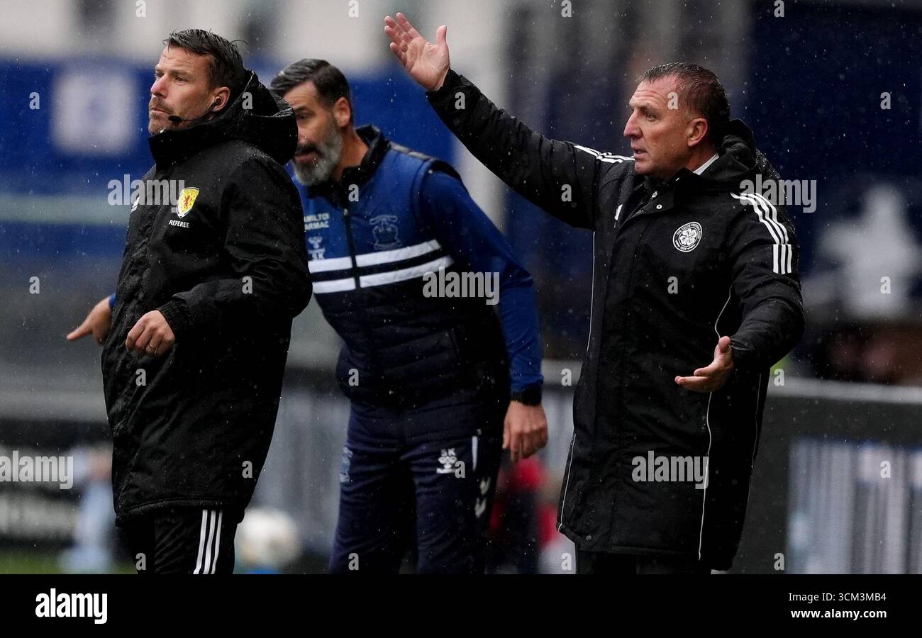 Celtic manager Brendan Rodgers (right) during the William Hill ...