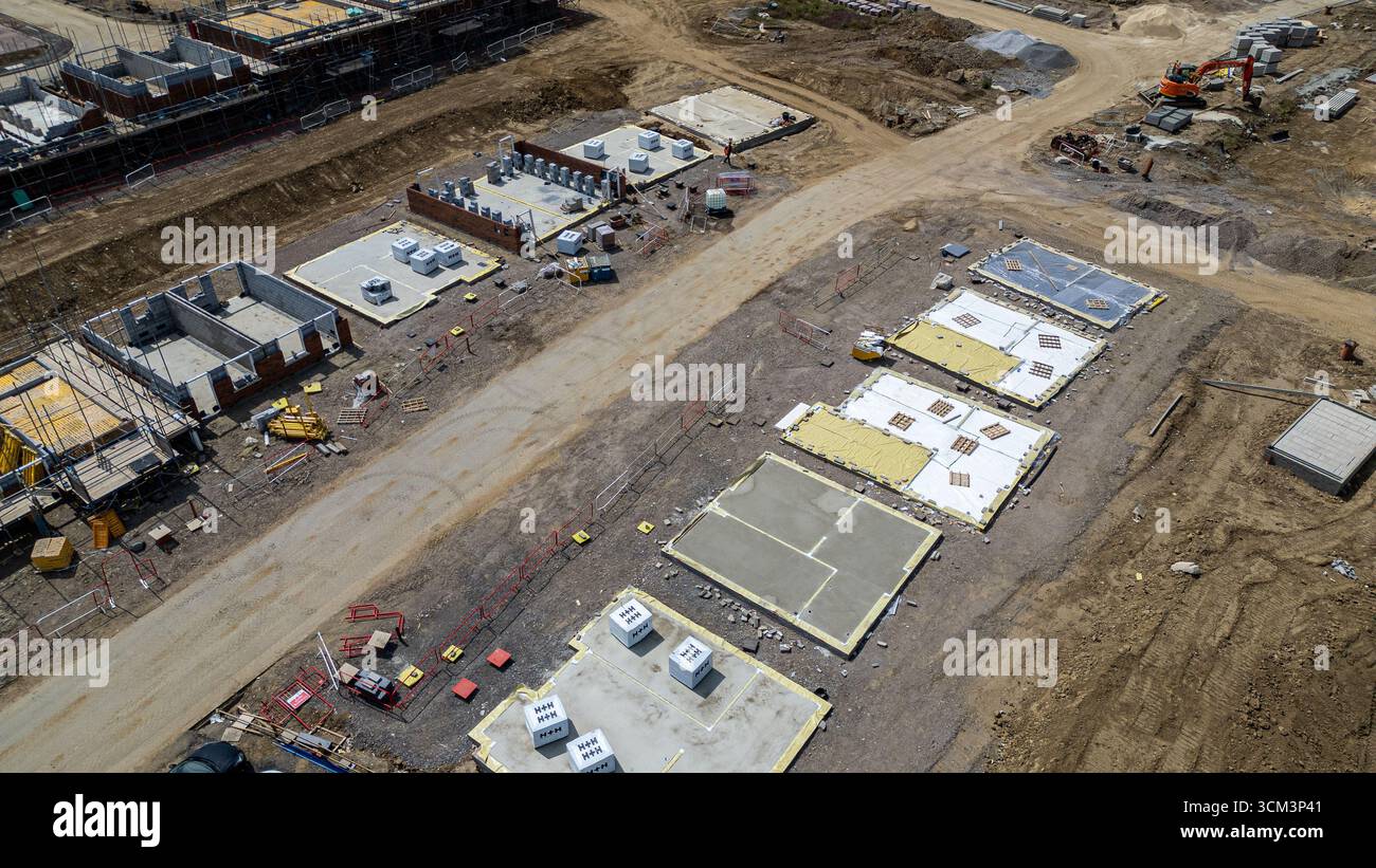 An aerial view of a construction site shows unfinished building ...