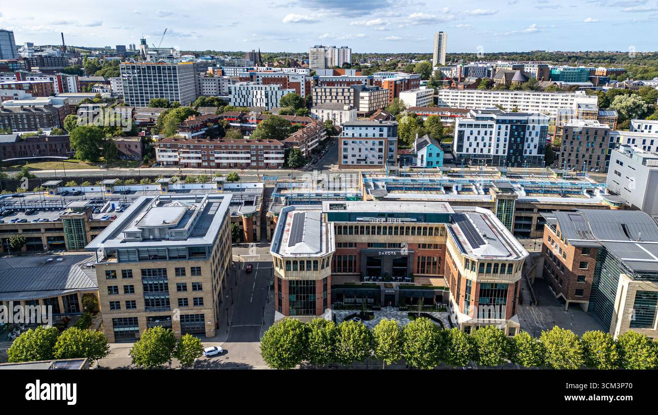 An aerial view of a modern urban cityscape featuring various buildings ...